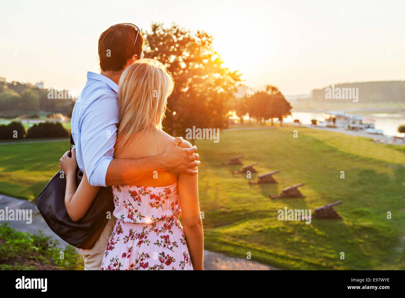 Happy young couple overlooking river scenery Stock Photo - Alamy