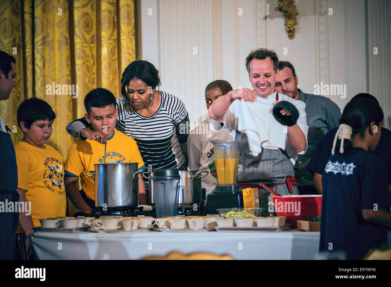 US First Lady Michelle Obama helps prepare a meal from produce ...