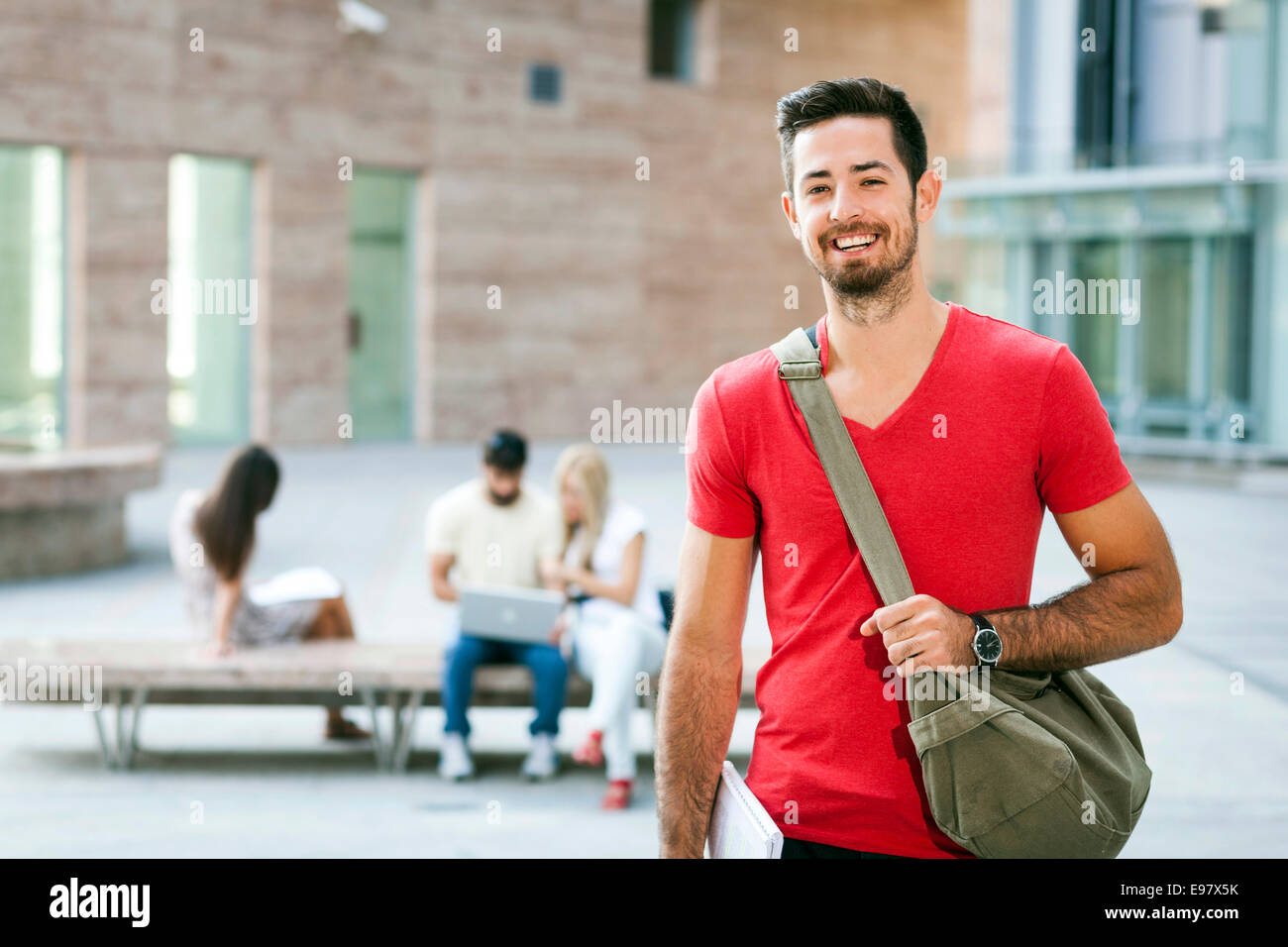 Portrait of male student, group of students in the background Stock ...