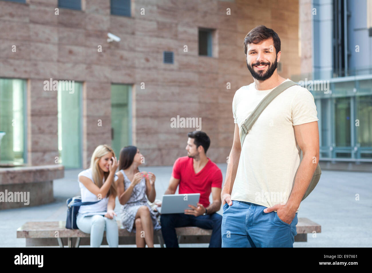 Group of students on campus grounds Stock Photo - Alamy