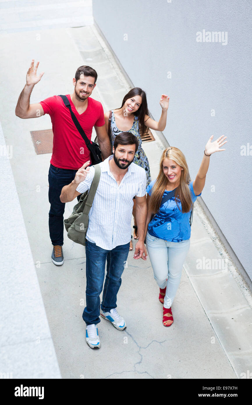 Group of university students waving on campus Stock Photo - Alamy
