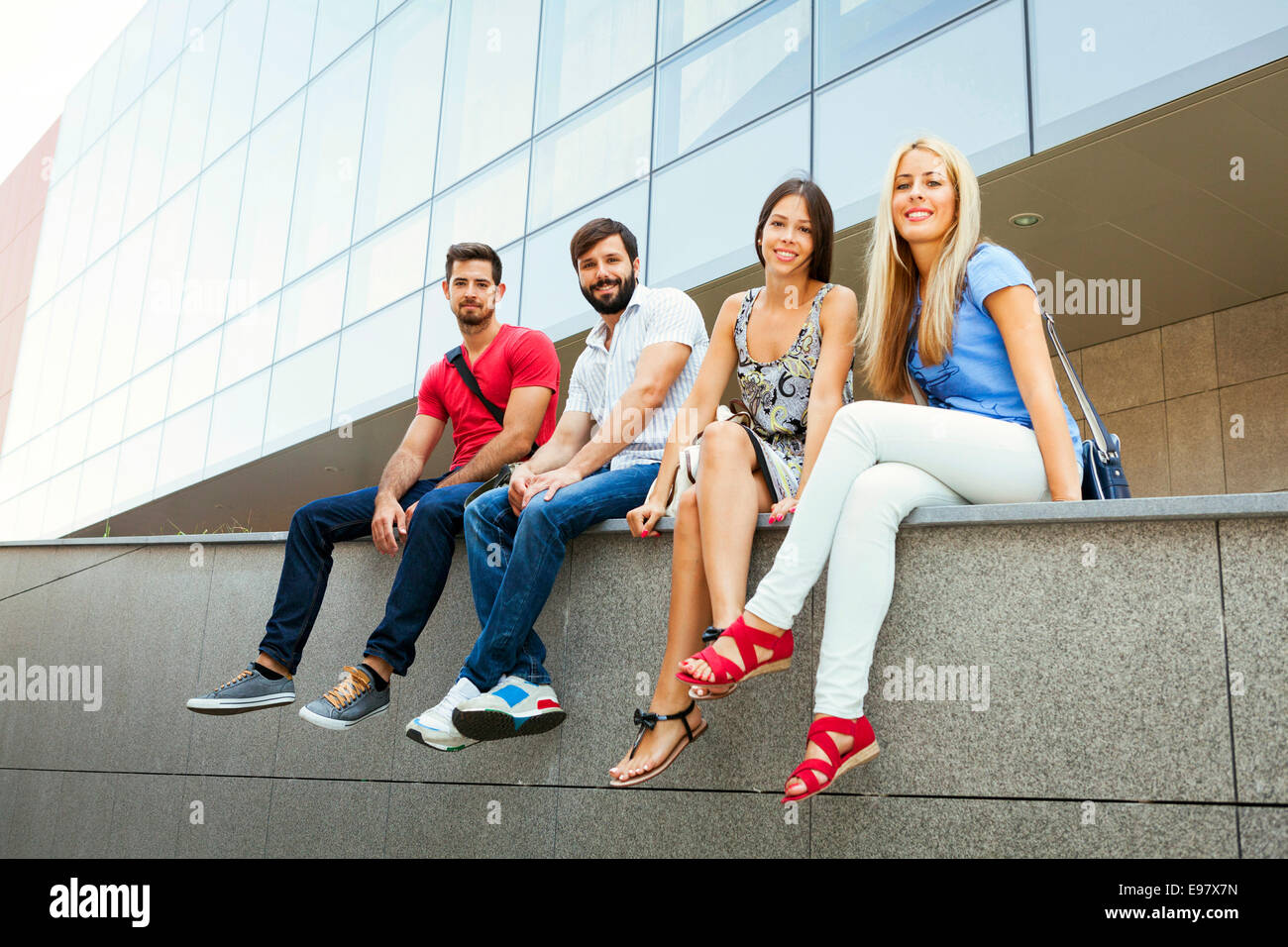 Group of university students sitting on campus Stock Photo - Alamy