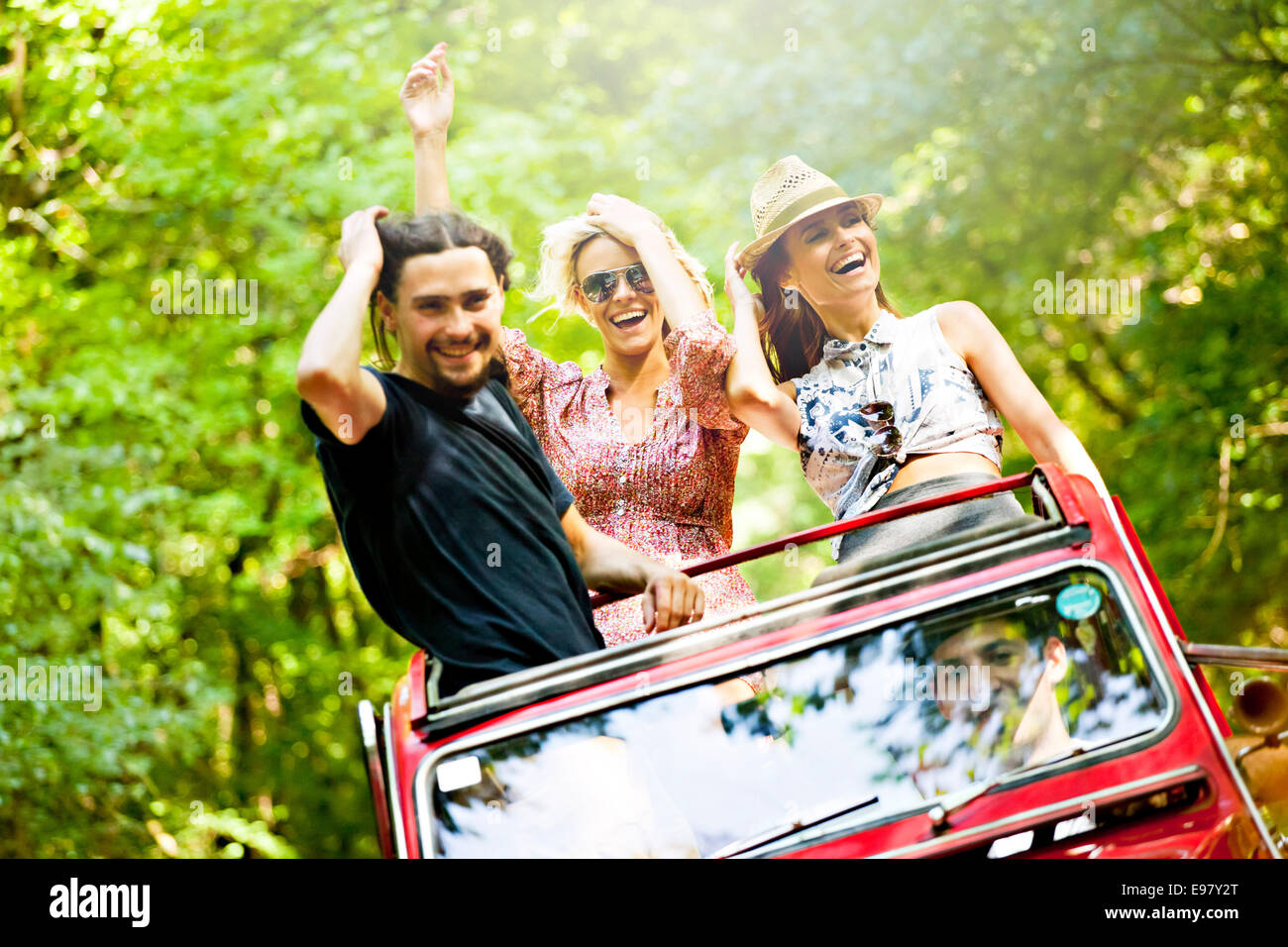 Young people in convertible car having fun Stock Photo - Alamy