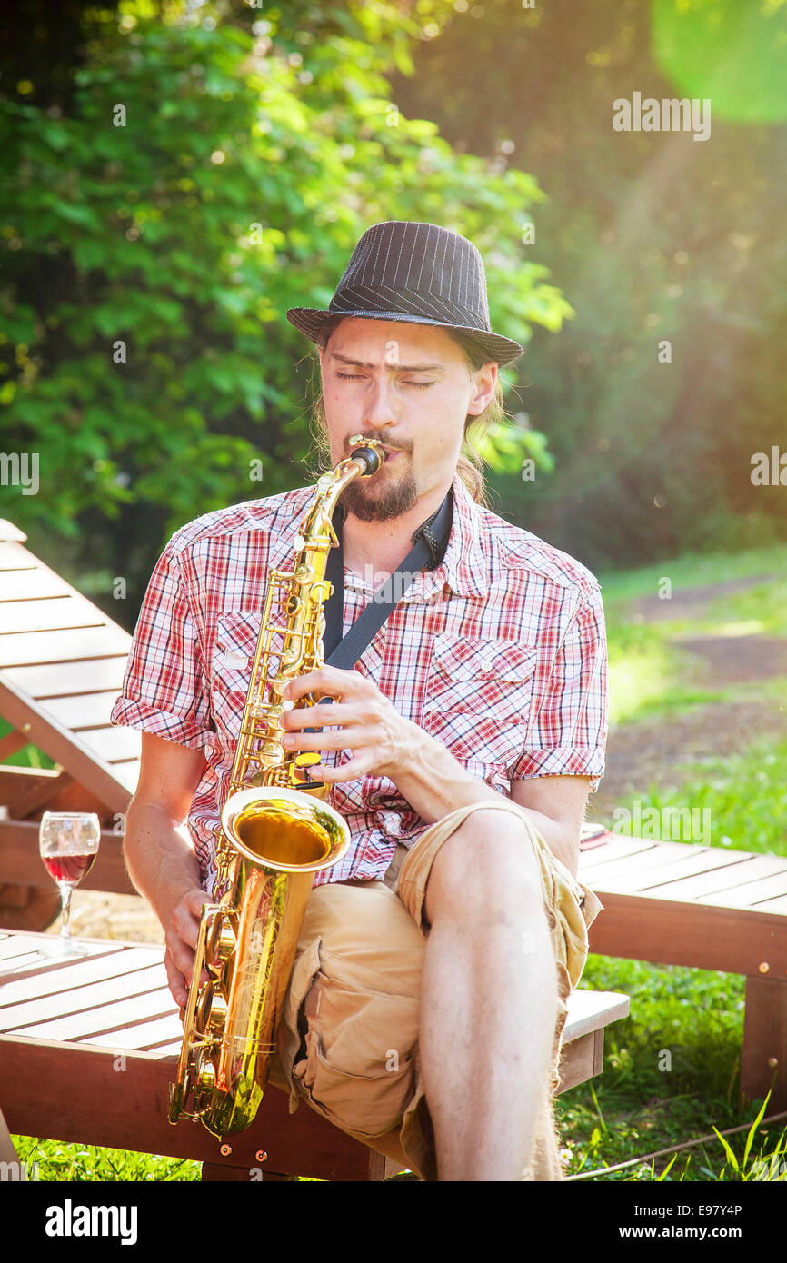 Portrait man playing saxophone hi-res stock photography and images - Alamy