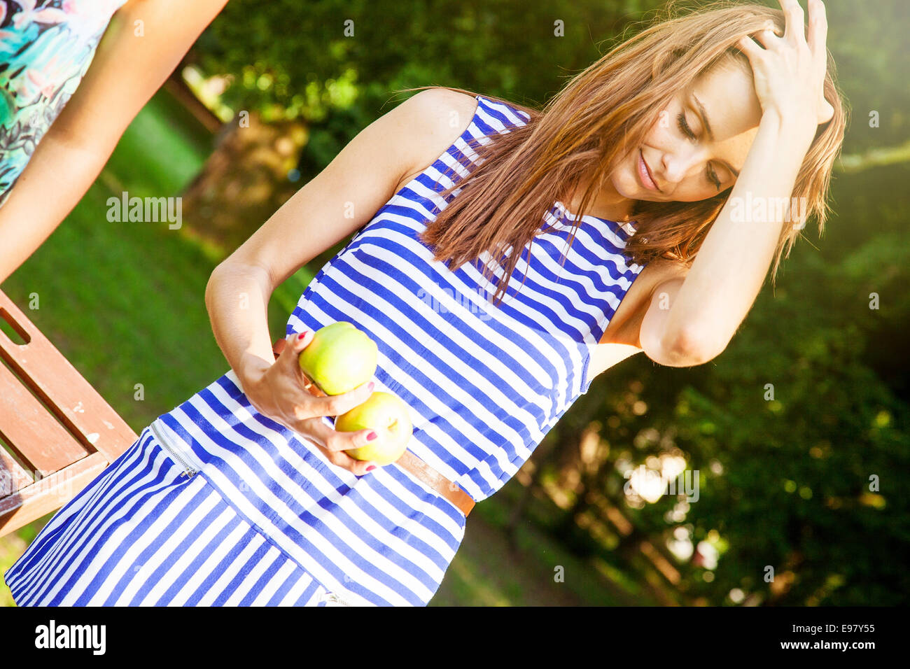 Woman in striped shirt holding hi-res stock photography and images - Alamy