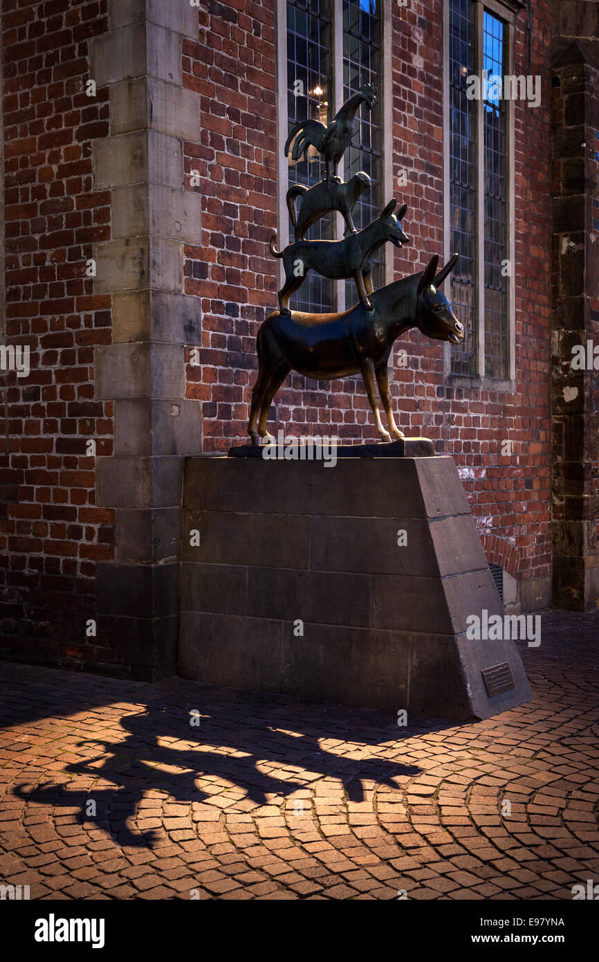 Statue of donkey, dog, cat and rooster standing on top representing ...