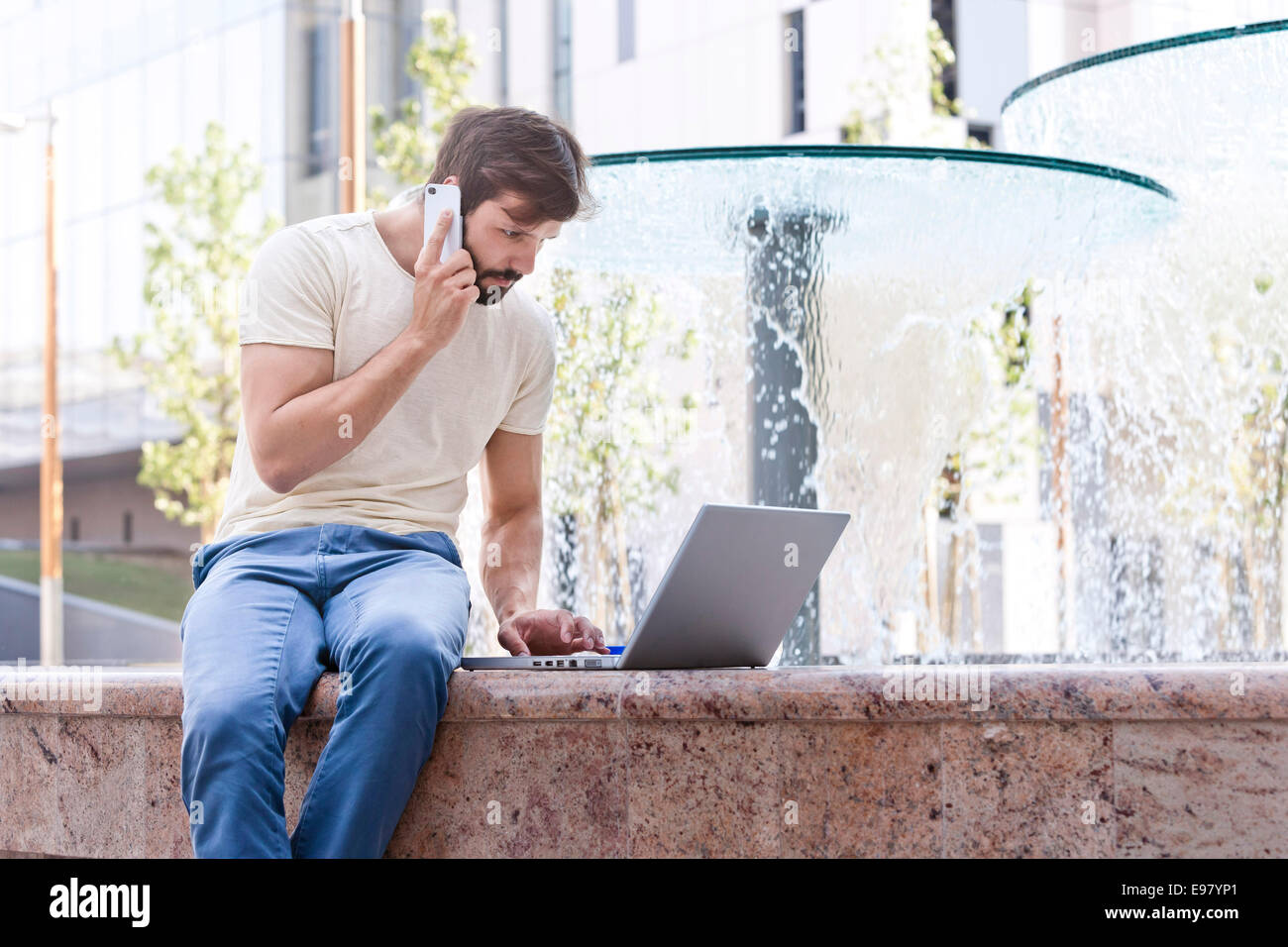 Male college student multitasking hi-res stock photography and images ...
