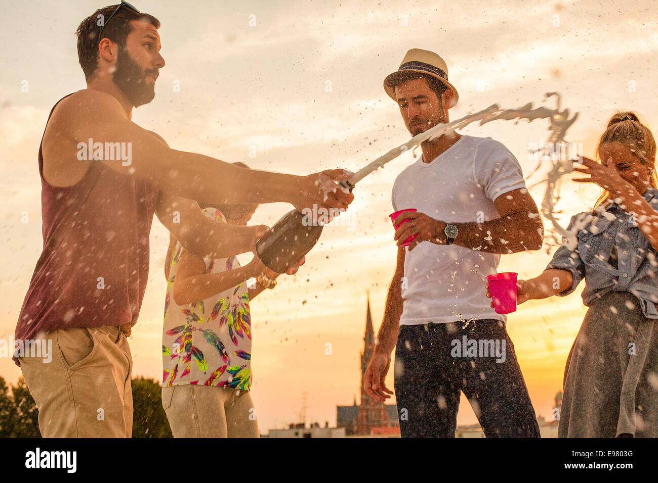 Young people at rooftop party fooling around Stock Photo - Alamy