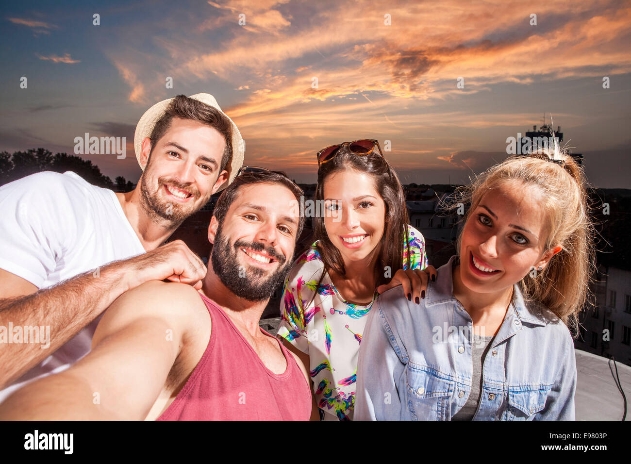 Young people having fun at rooftop party Stock Photo - Alamy