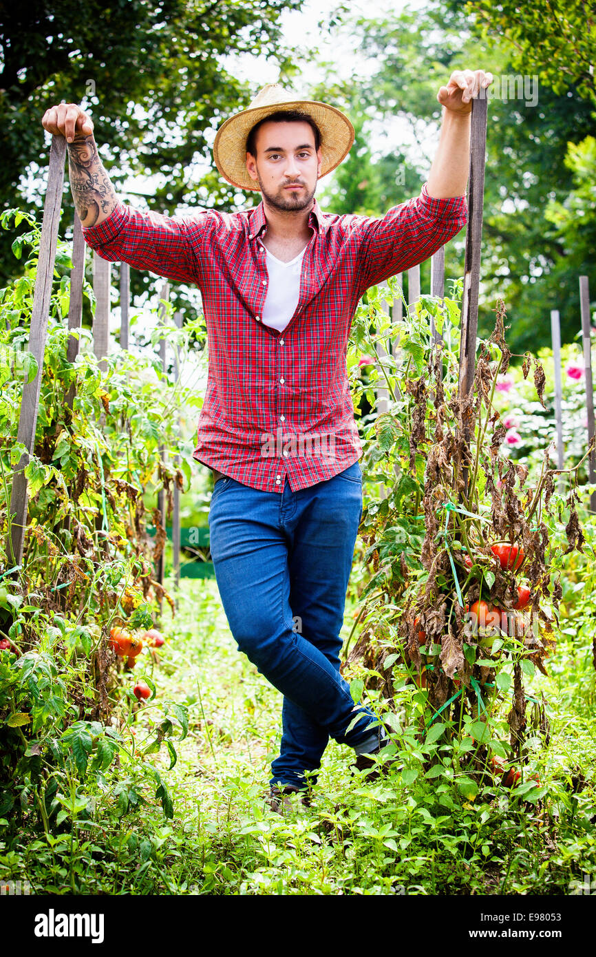 Portrait of young man in vegetable garden Stock Photo - Alamy