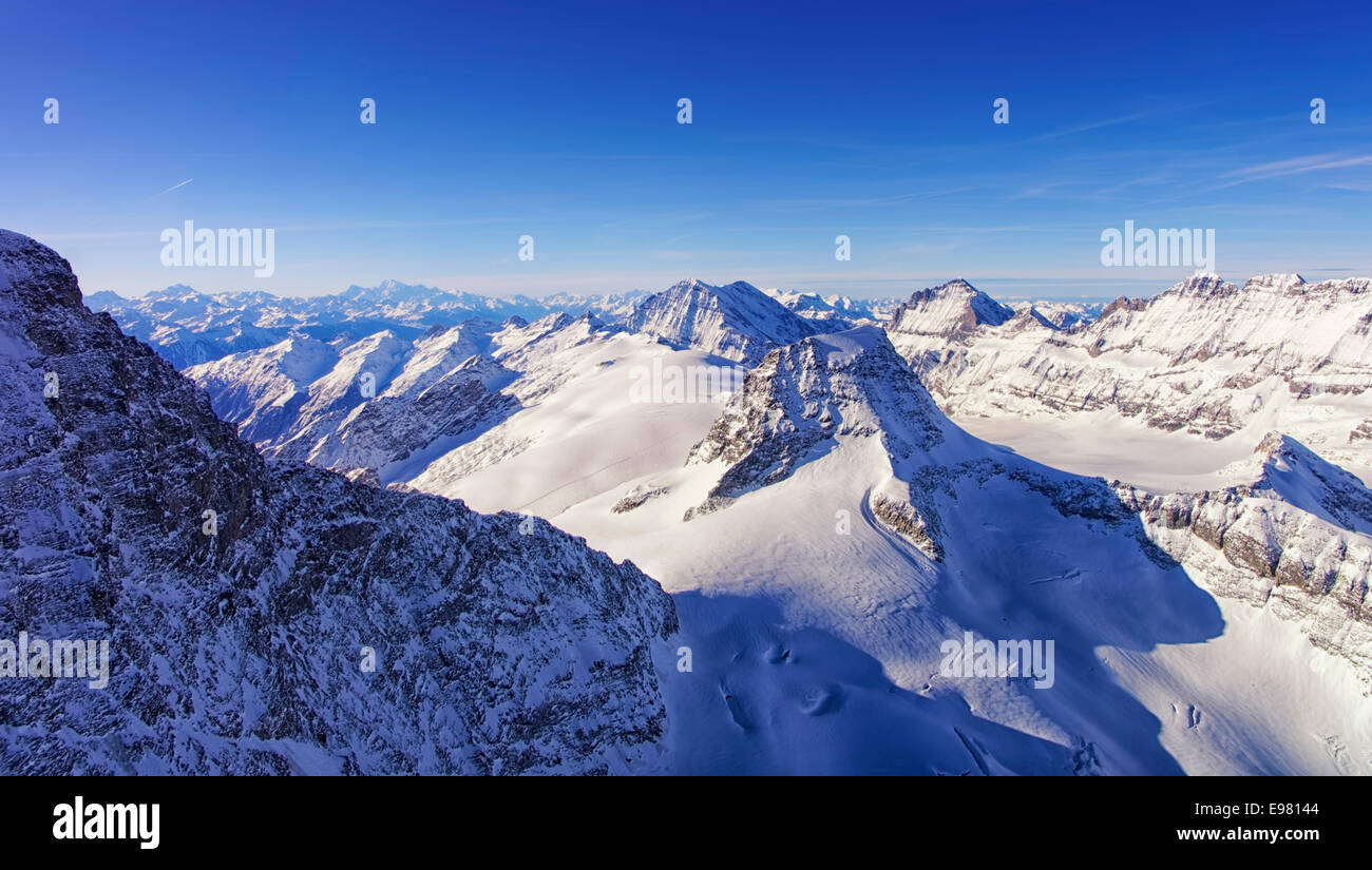 Peaks chain skyline and valley in Jungfrau region helicopter view in ...