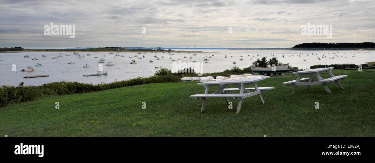 Lovely vacation spot view white picnic tables overlooking harbor full ...