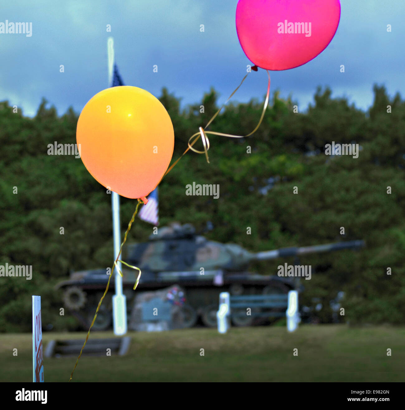 Contrast yellow red-purple balloons on gold ribbon in foreground ...