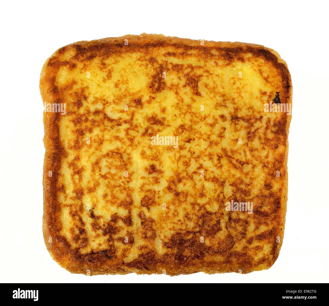 Slice of french toast on a white background Stock Photo - Alamy