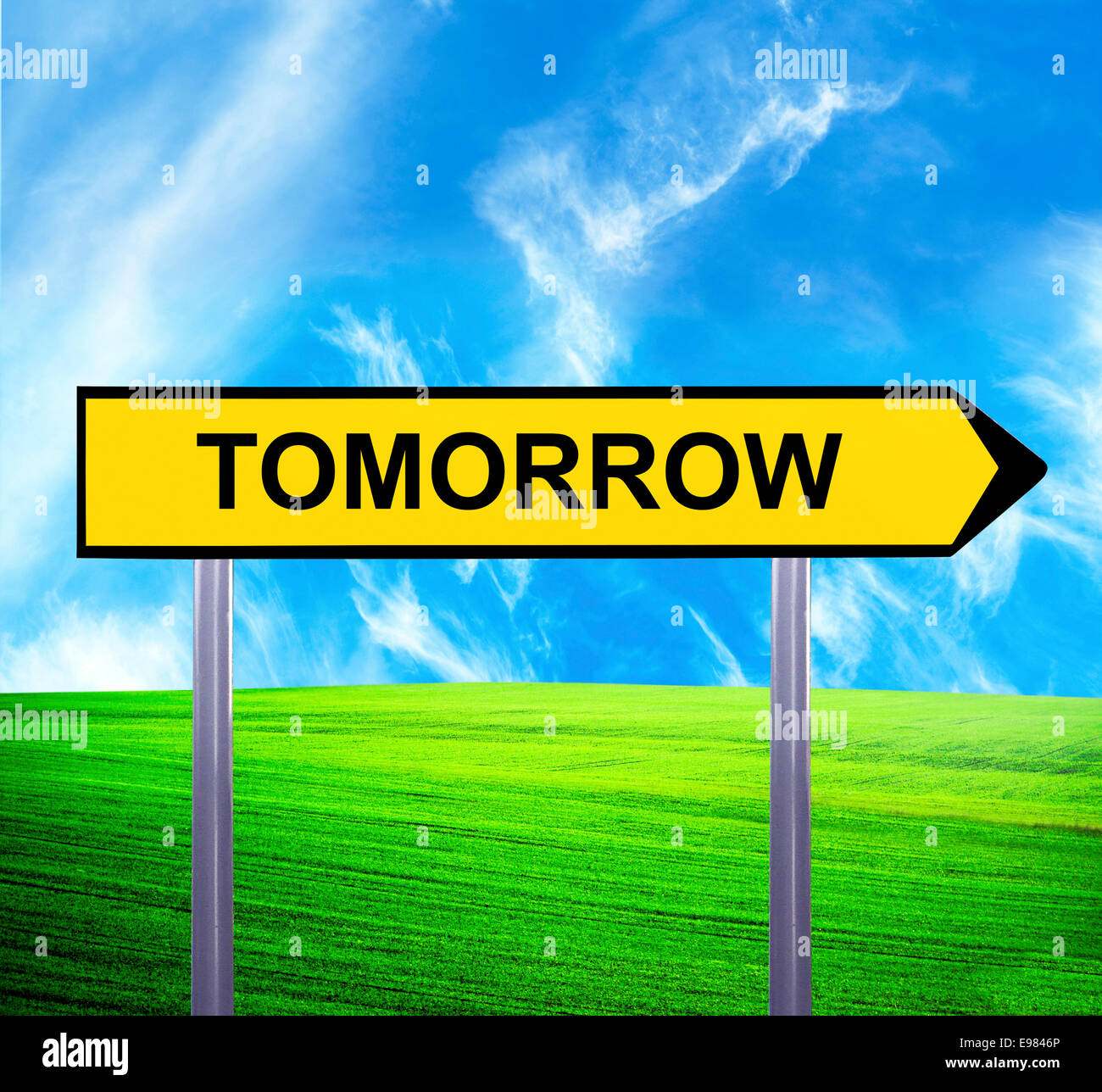 Conceptual arrow sign against beautiful landscape with text - TOMORROW ...
