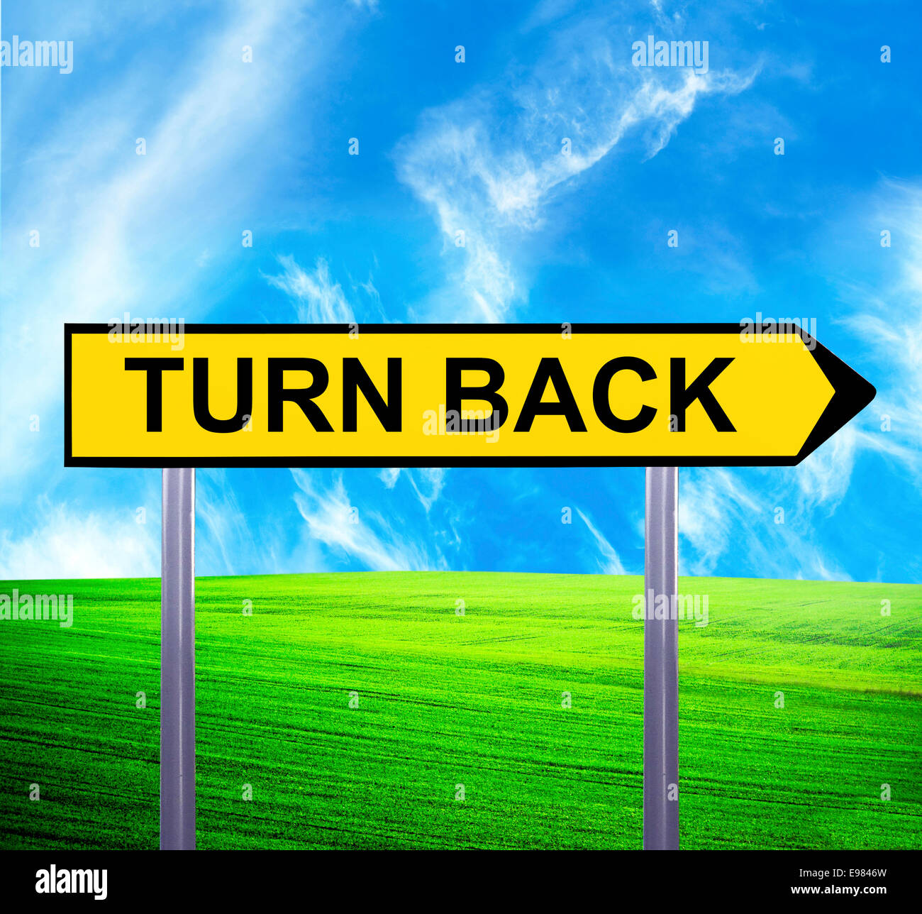 Conceptual arrow sign against beautiful landscape with text - TURN BACK ...