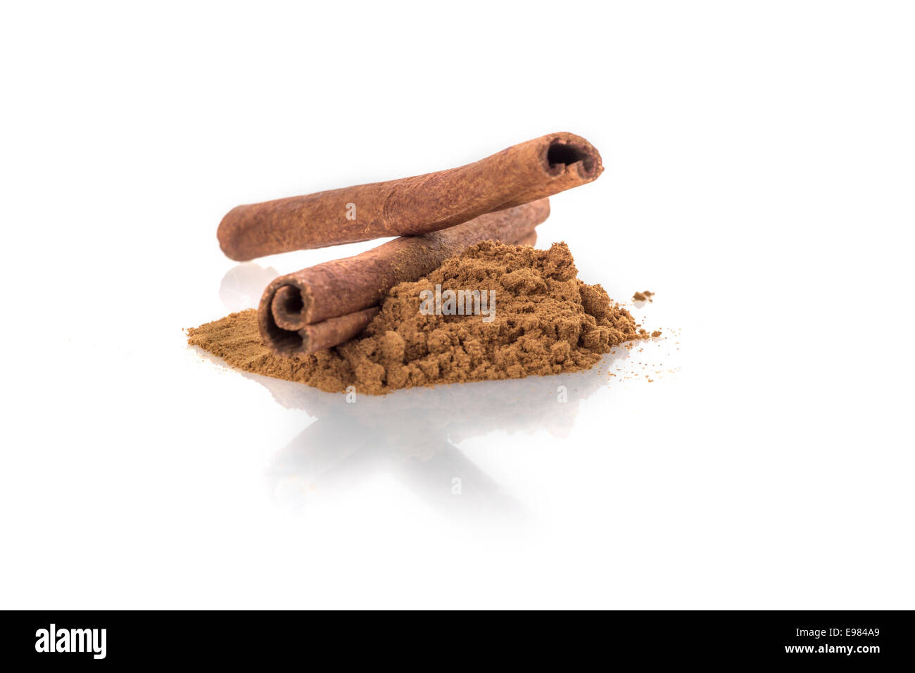 Cinnamon Sticks and powder isolated on white background Stock Photo - Alamy