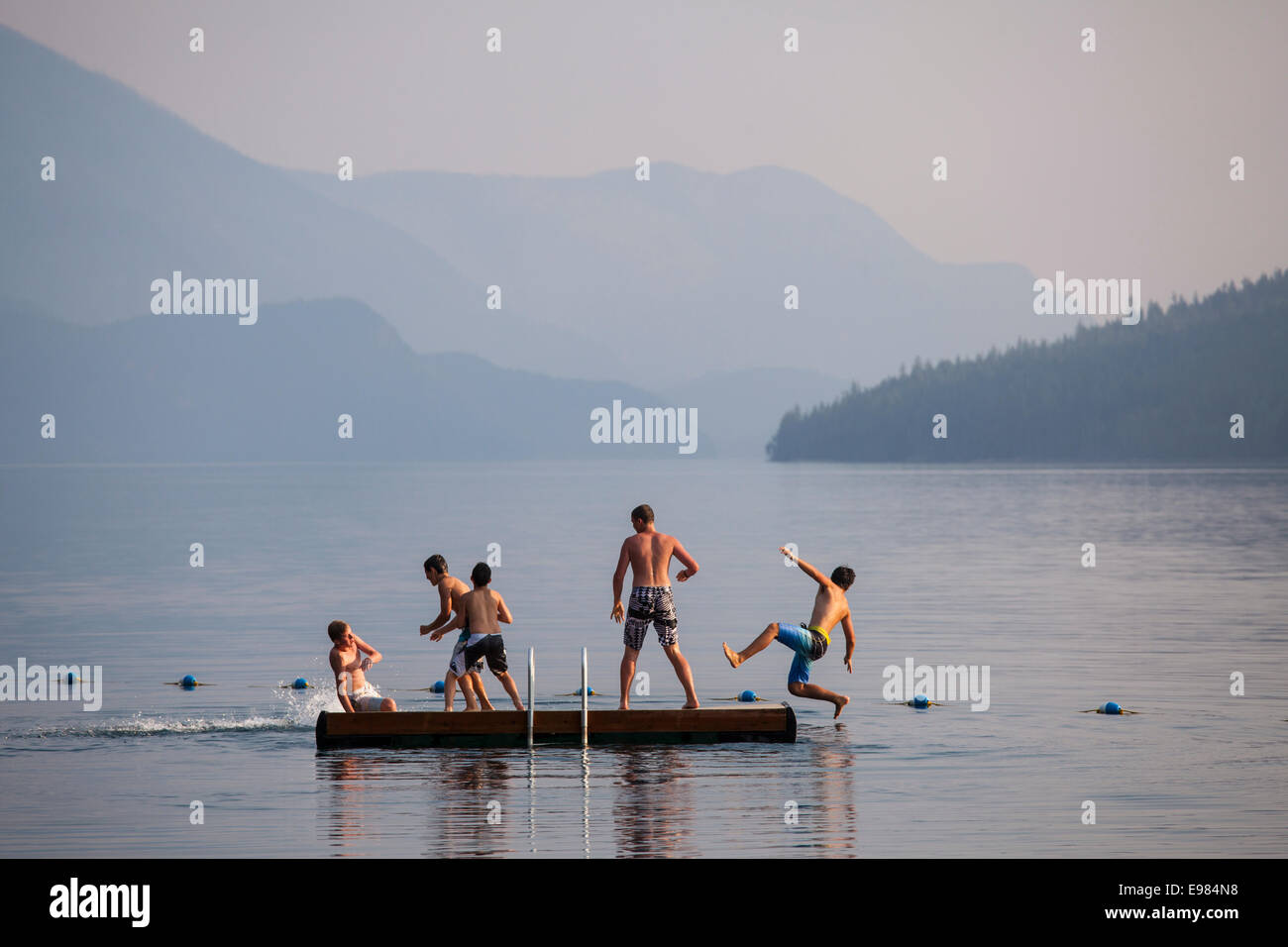 Young boys playing on Slocan Lake, New Denver, Slocan Valley, West ...