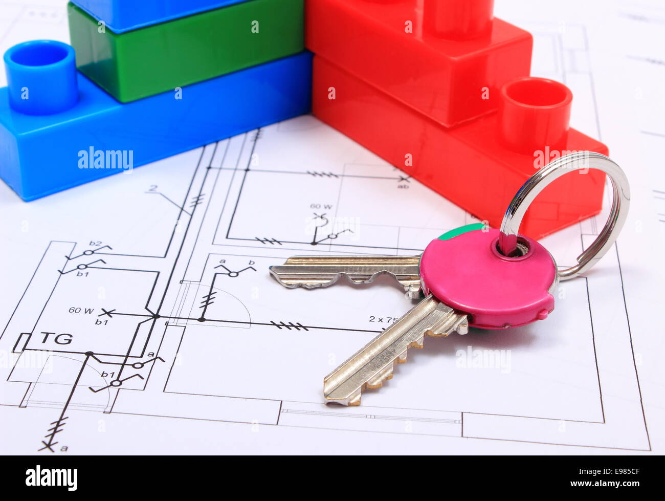 Home keys and wall of plastic colorful building blocks lying on ...
