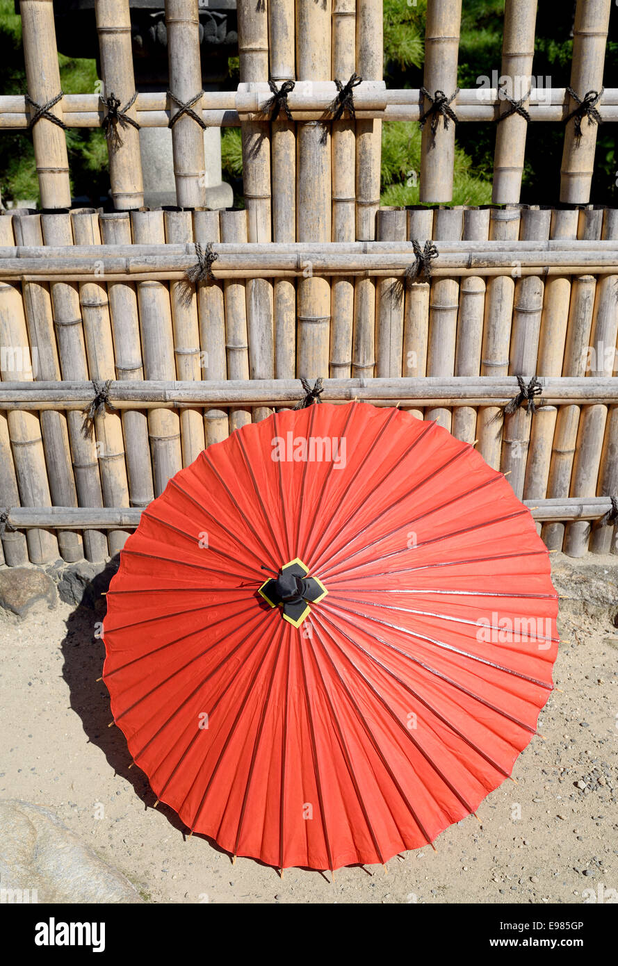 Japanese red umbrella with bamboo fence Stock Photo - Alamy