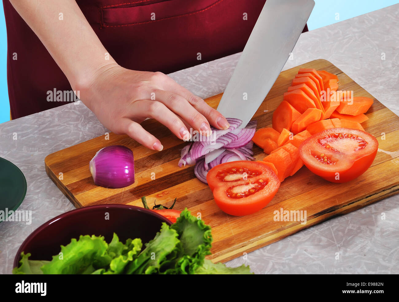 human hands cooking vegetables salad in kitchen Stock Photo - Alamy