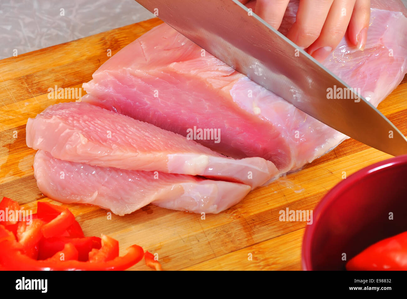 hand slicing meat, close up Stock Photo - Alamy