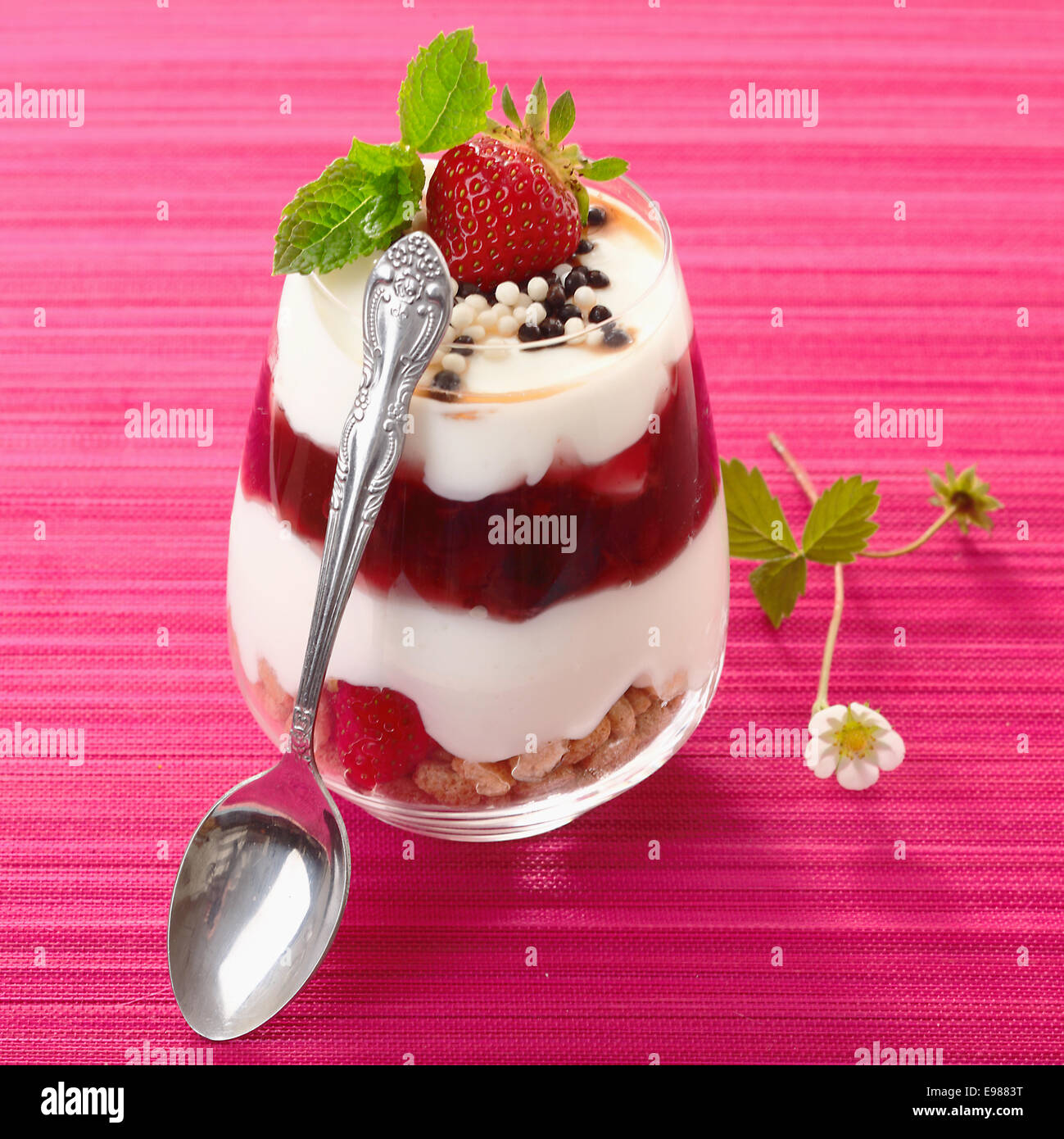 Individual serving of a gourmet strawberry dessert with layered cream ...