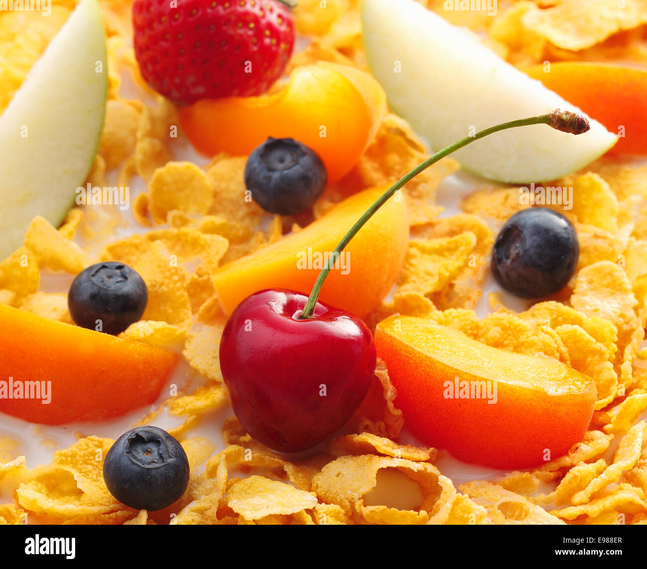 Assorted Fruits on cornflakes. Cherries,Blueberries,and apple pieces ...