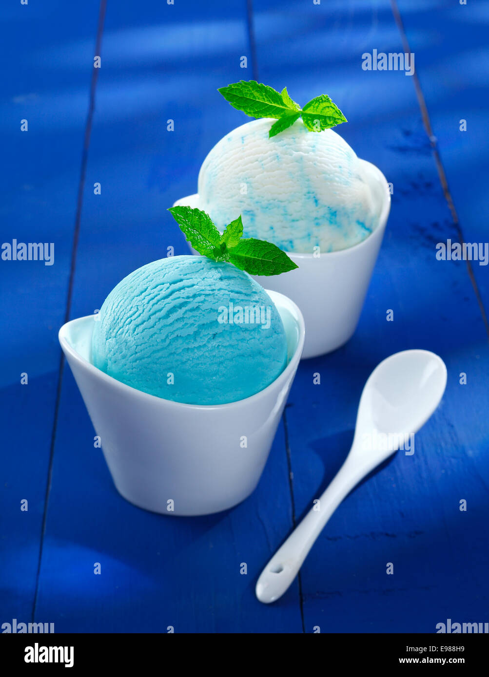 Servings of refreshing blue Italian icecream in decorative boat shaped ...