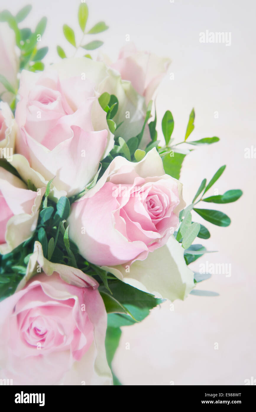Closeup of a beautiful pink rose in an arrangement of fragile pink ...