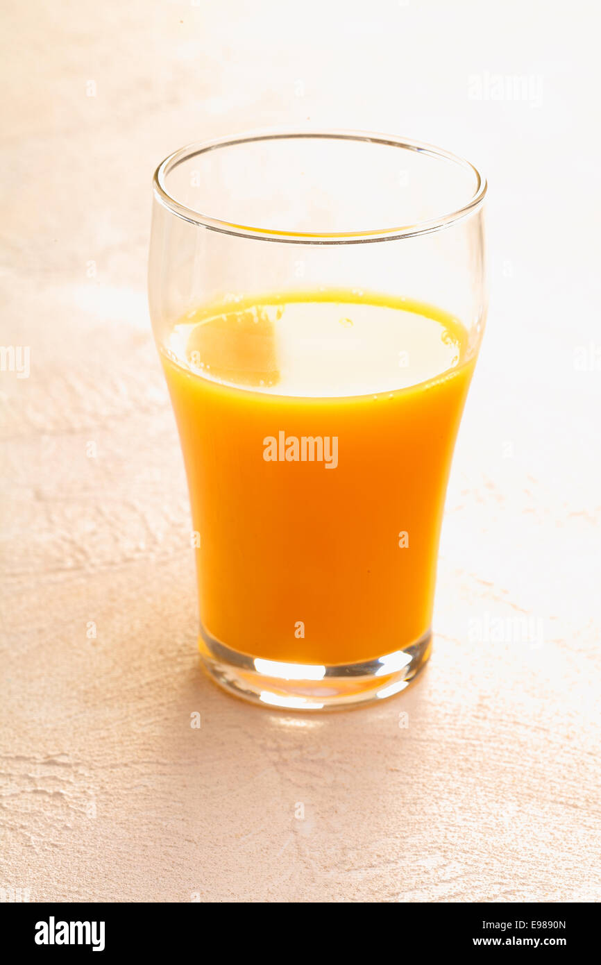 Half Glass Of Orange Juice