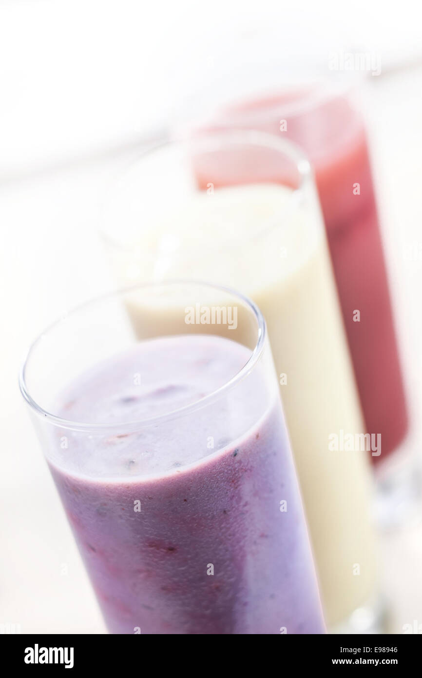 High angle view of a row of assorted fruit smoothies or milkshakes ...
