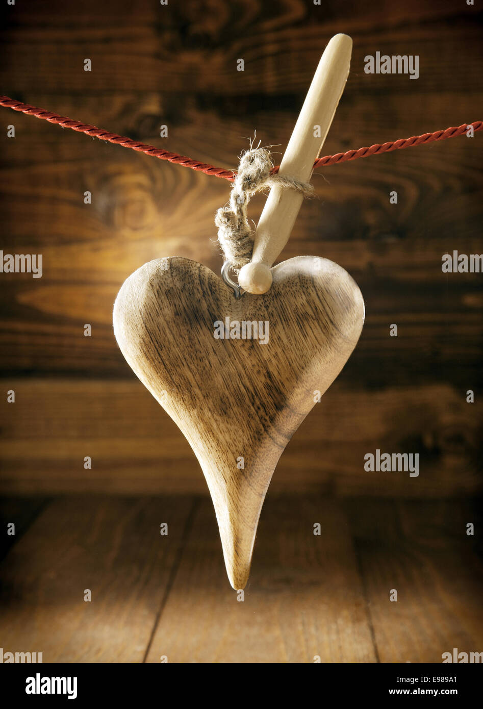 Handcrafted rustic wooden textured heart with woodgrain hanging on a ...