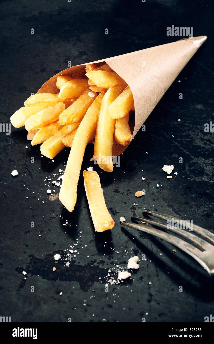 Hot salty fried potatoes in paper cornet hi-res stock photography and ...