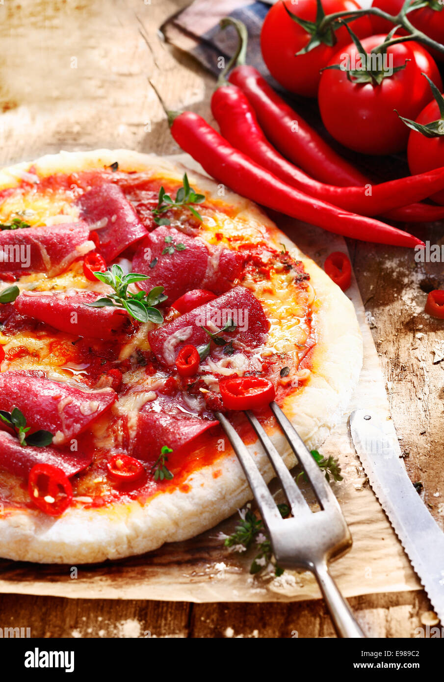 Tasty fresh homebaked pepperoni pizza served topped with sliced hot red ...