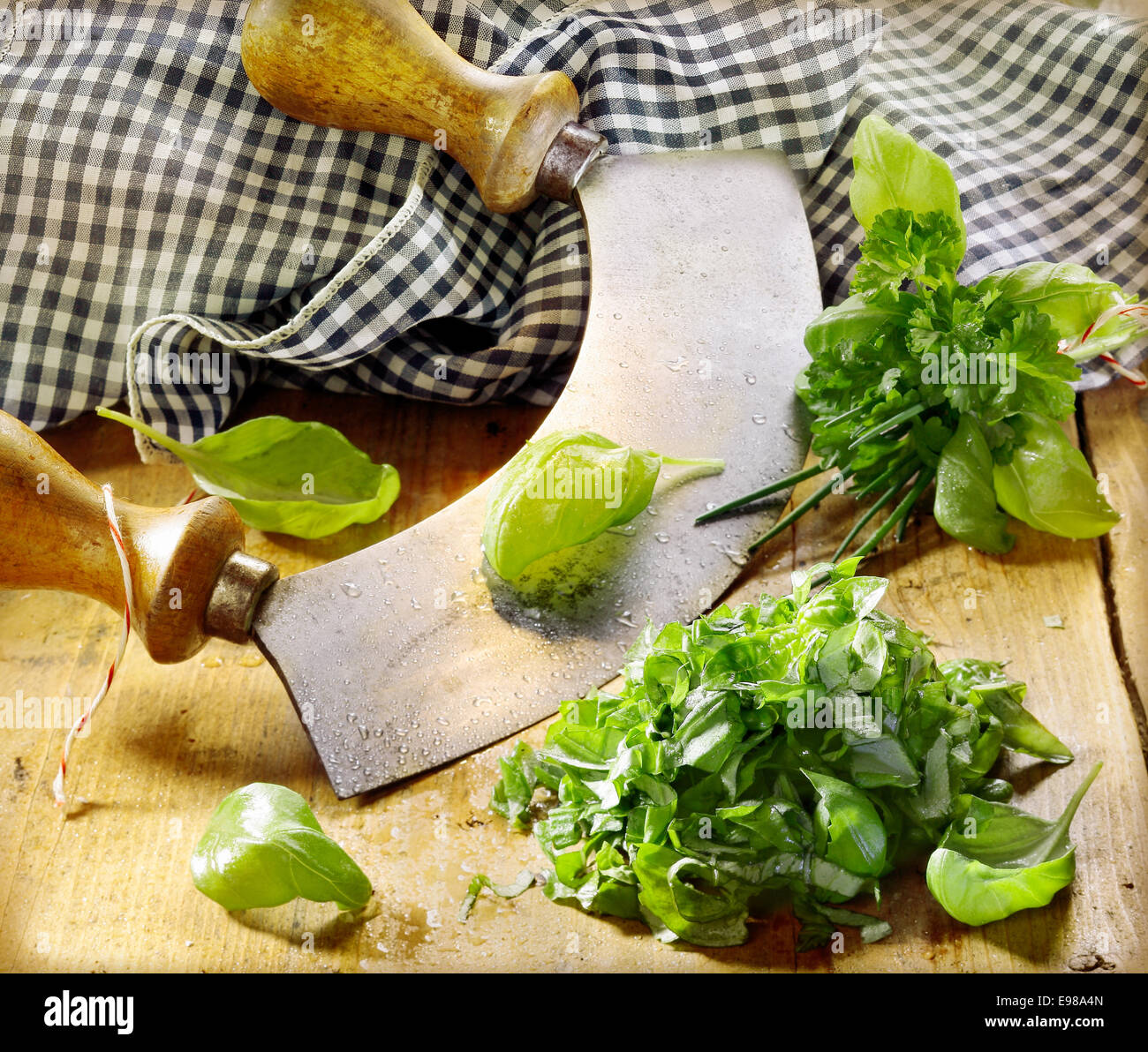 Pile of fresh aromatic green basil leaves to be chopped for use as a ...
