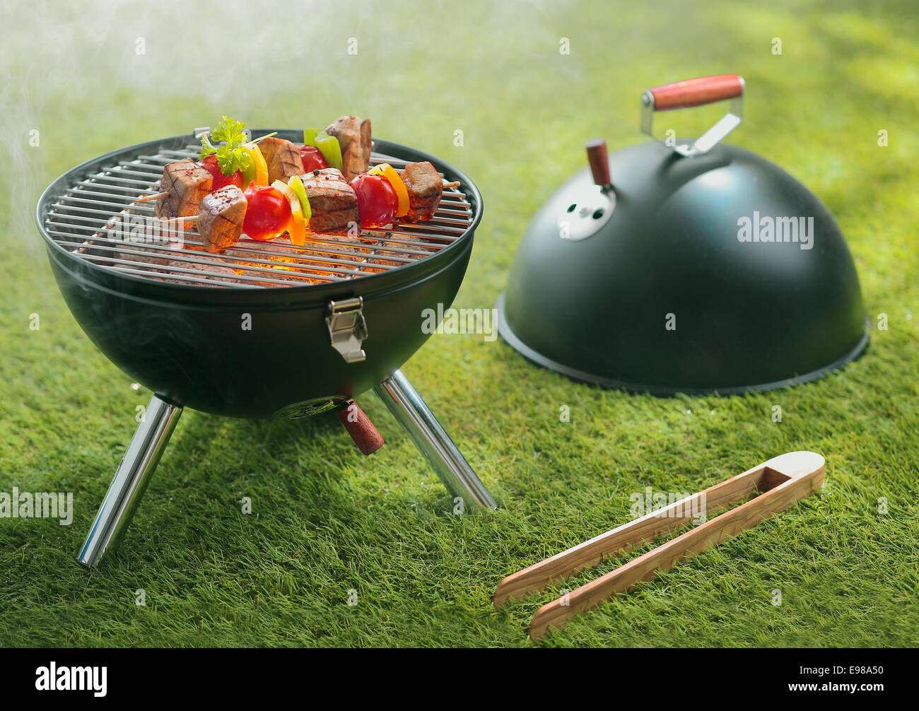 Barbecue cookout with delicious lean beef and vegetable kebabs grilling ...