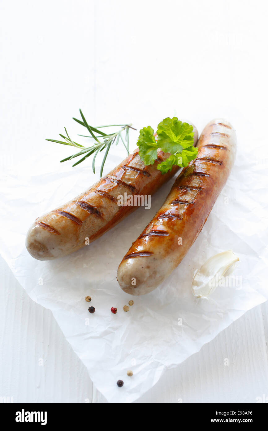 Close up grilled sausage over the white background Stock Photo - Alamy