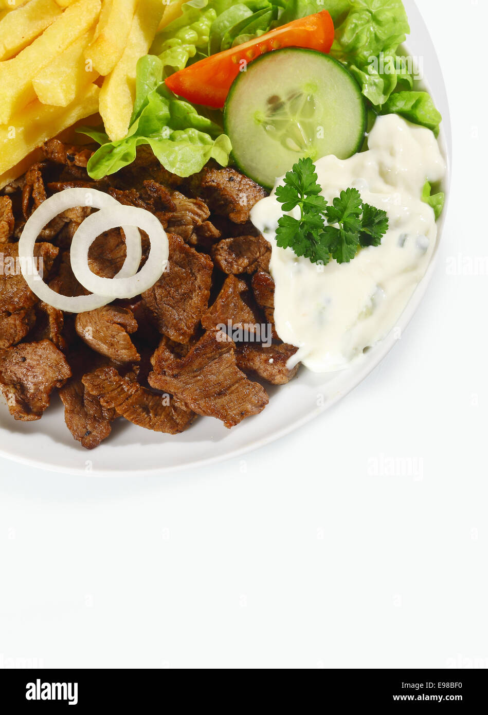 Sauteed lean beef nuggets with mixed salads and golden oven-baked or ...
