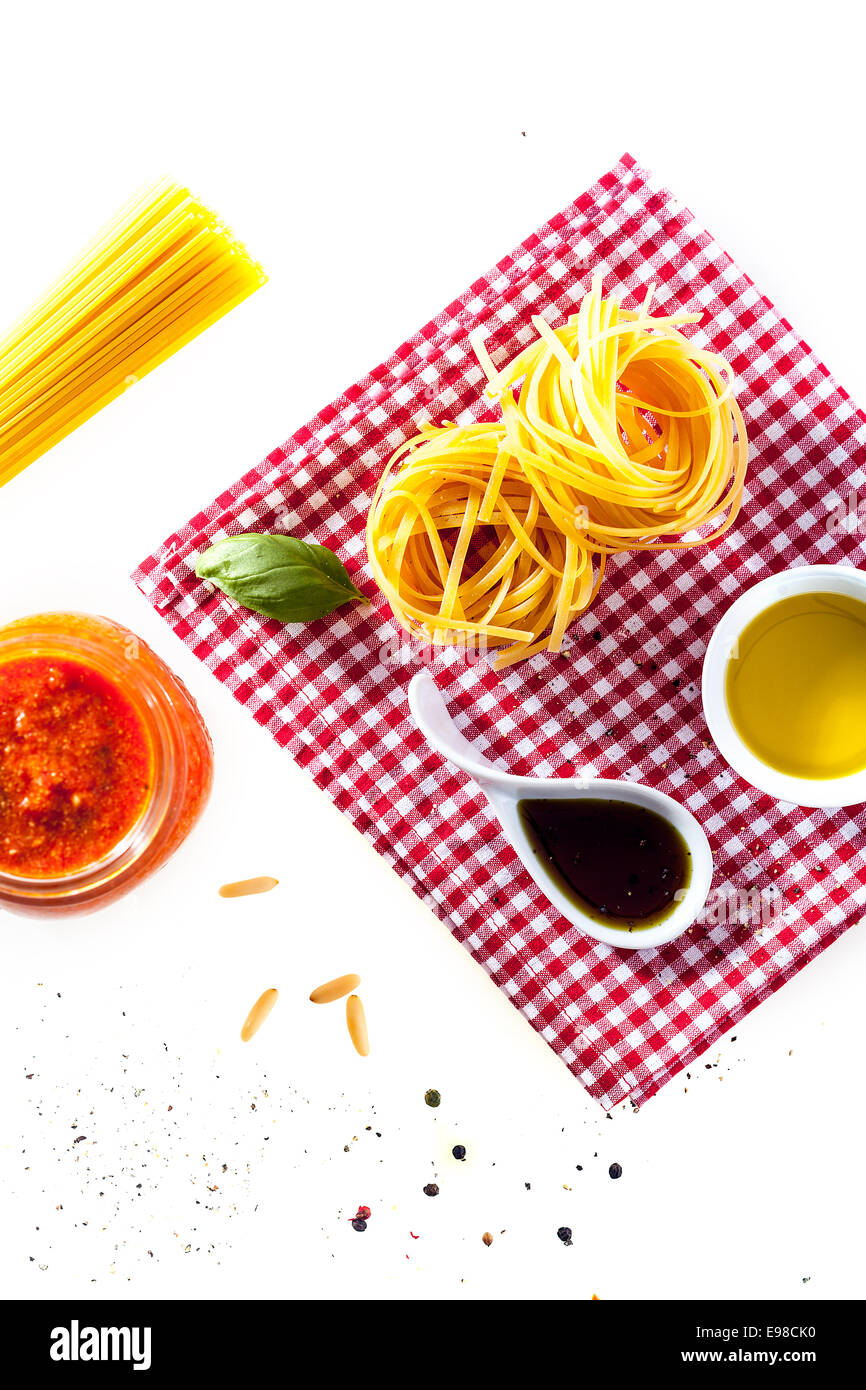 Ingredients for healthy Italian cuisine with uncooked spaghetti and ...