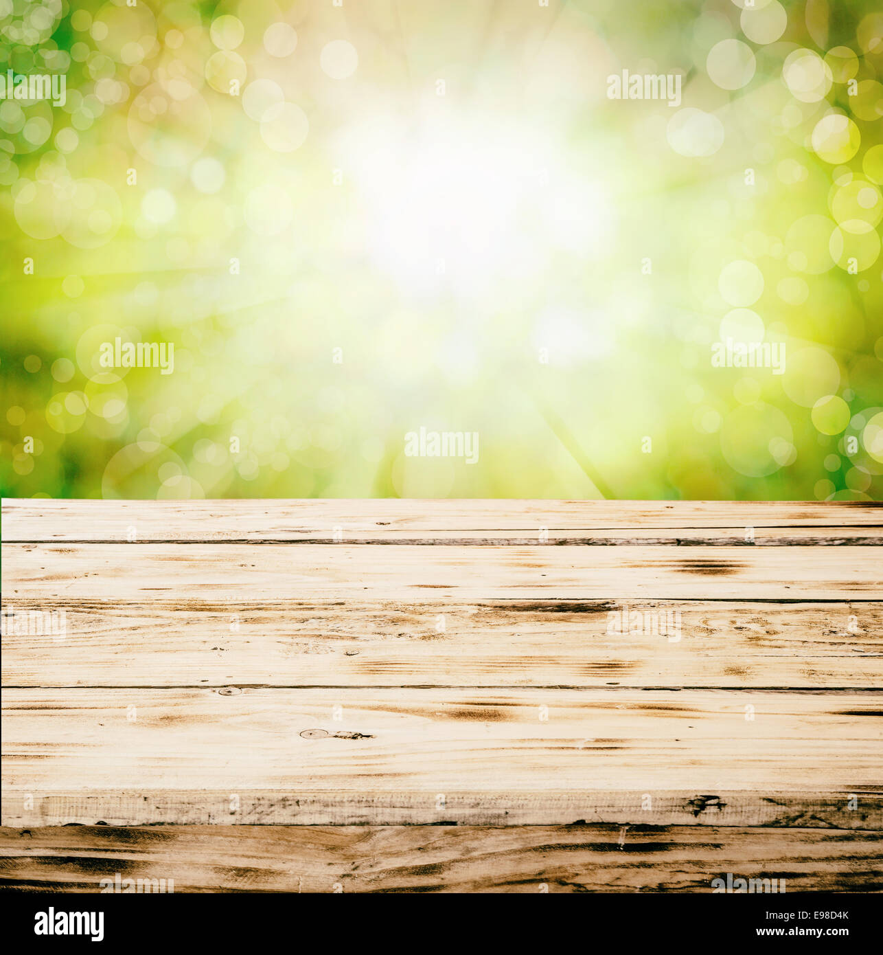 Old empty rustic grunge wooden table top outdoors in the countryside ...