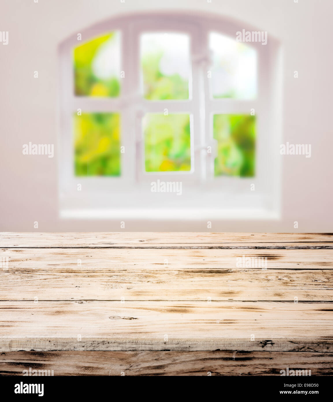 Empty scrubbed clean rustic wooden kitchen table under a pretty white ...