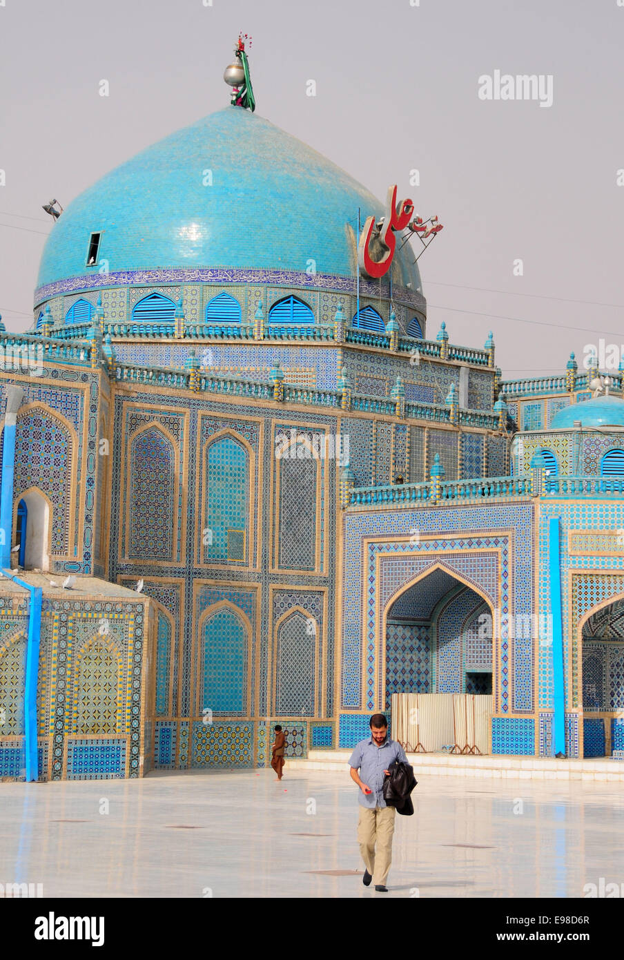 Balkh, Afghanistan. 21st Oct, 2014. An Afghan man walks at Hazrat-e-Ali ...