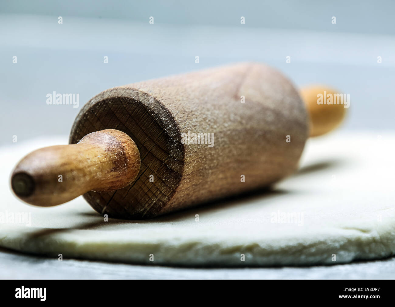 Close-up low angle view of an old-fashioned wooden rolling pin on ...