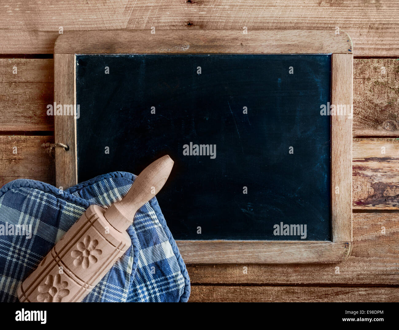 Decorative wooden rolling pin carved with patterns of flowers lying on ...