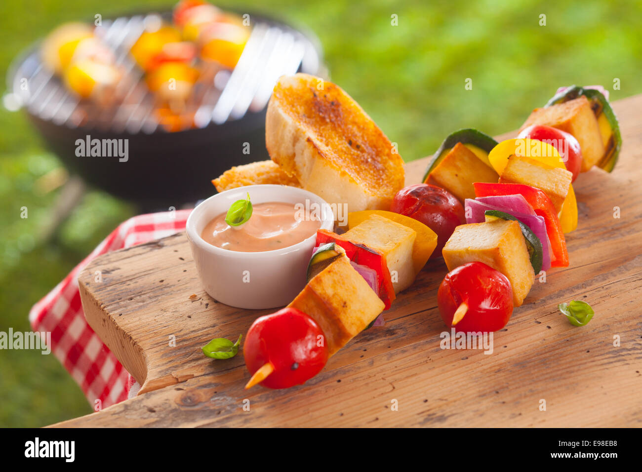 Healthy picnic lunch at a summer barbecue with grilled smoked Tofu and ...