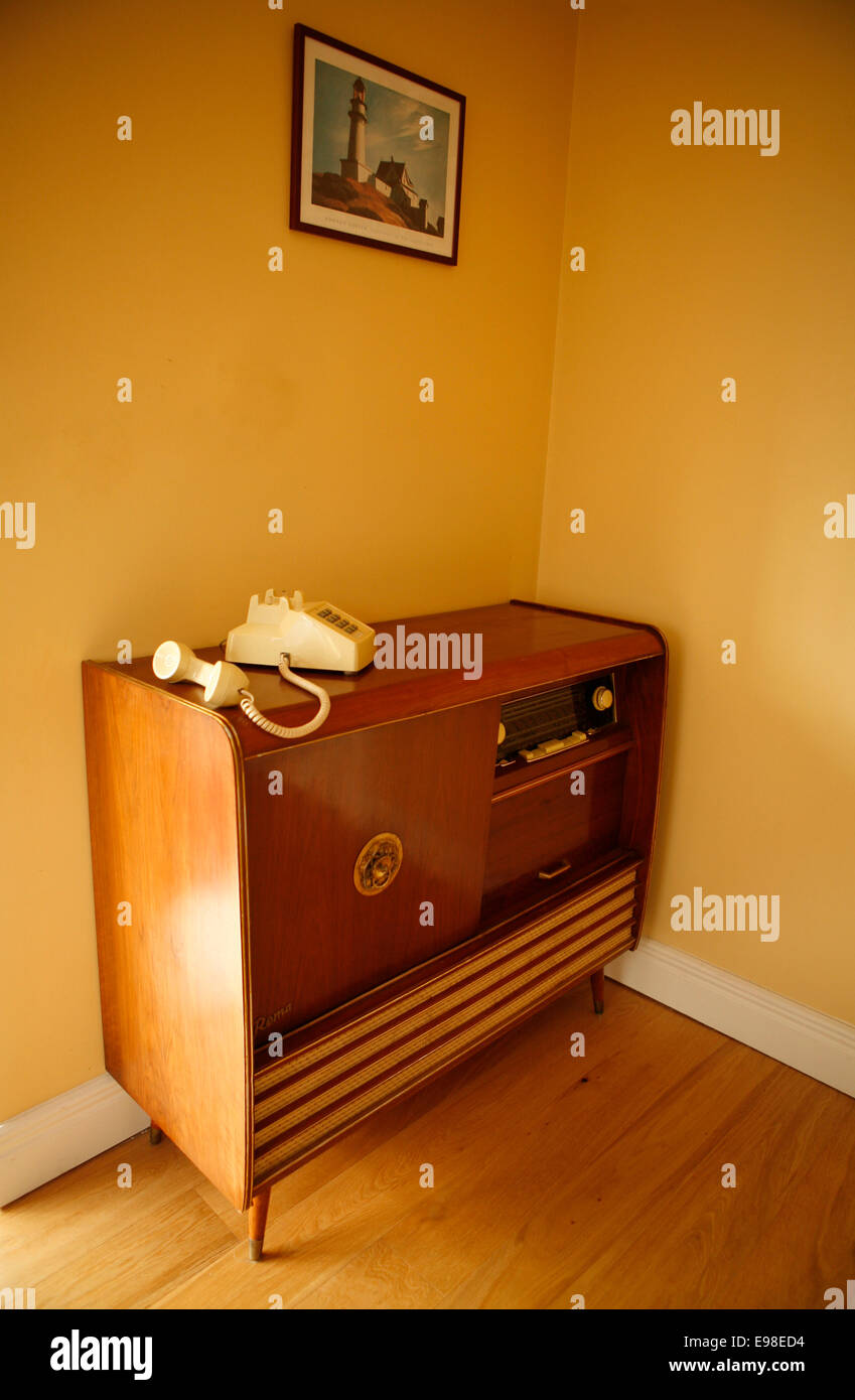Old-fashioned wooden brown radio box with phone on it Stock Photo - Alamy