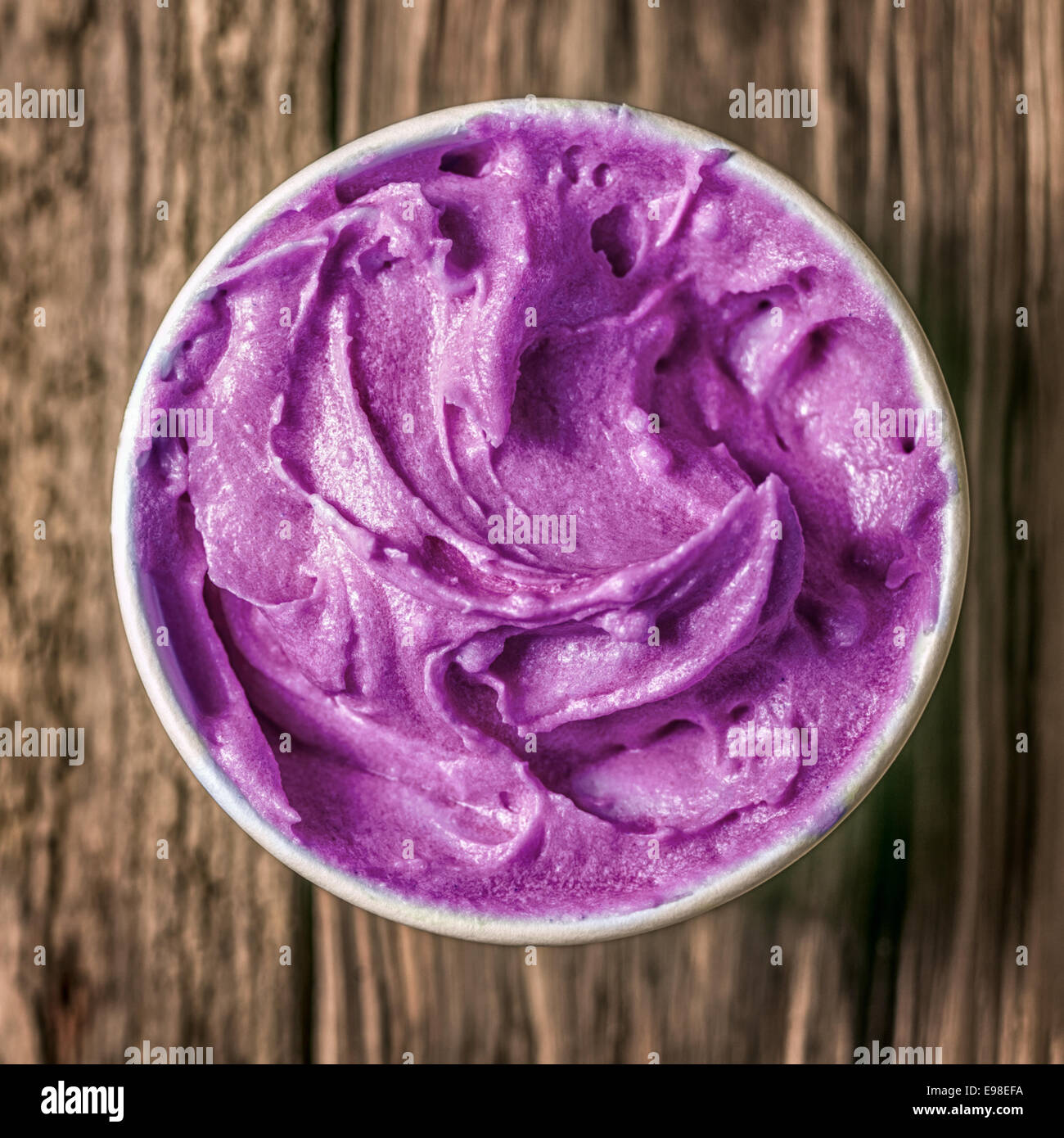 Close up overhead view of a takeaway plastic tub of colorful purple ...