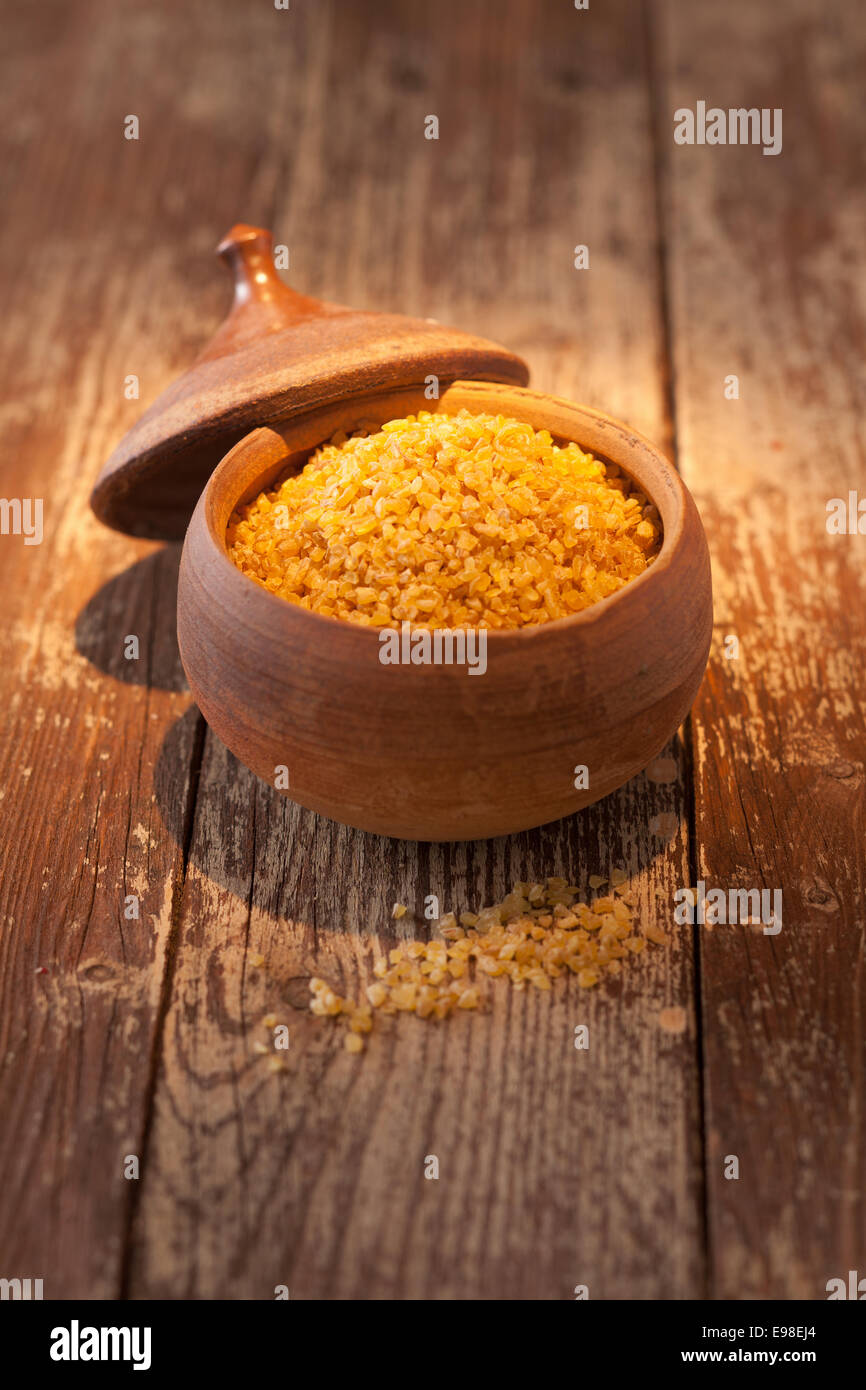 Earthenware pot of bulgur wheat, a form of cracked or dried crushed ...