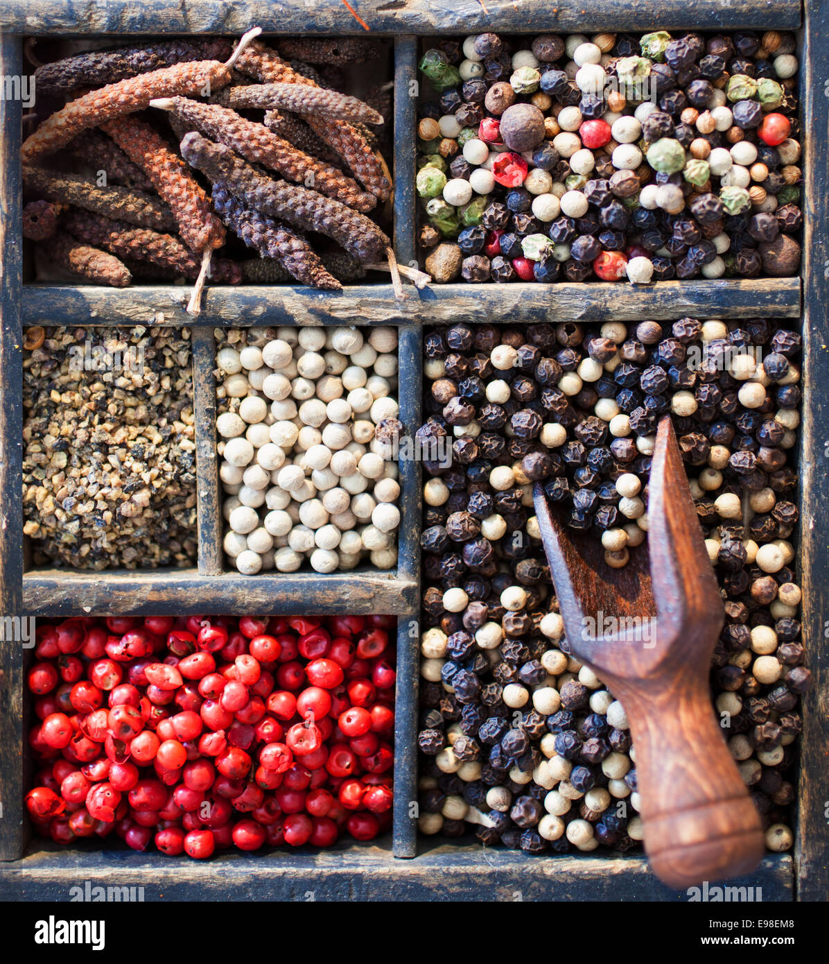 A selection of different peppercorns including, white, black, pink and ...